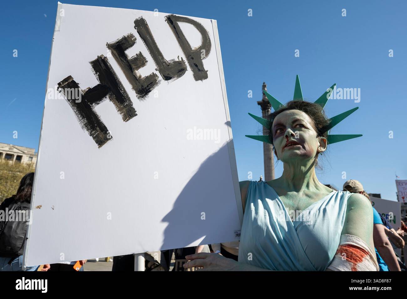 London, UK. 5 April 2025. A woman as the Statue of Liberty at a Hands ...