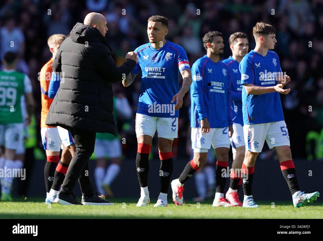 Hibernian manager David Gray with Rangers' James Tavernier following ...