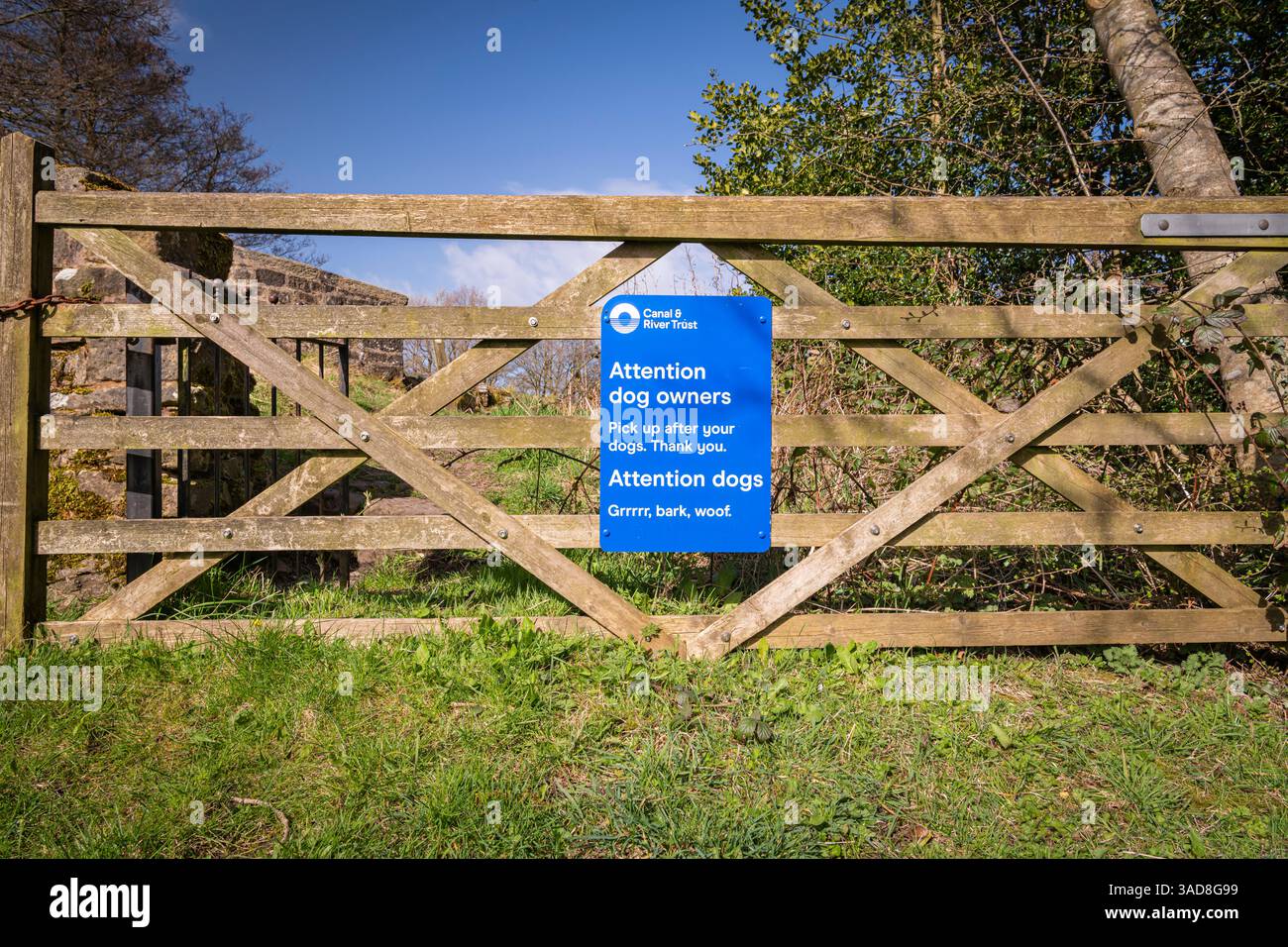 A spring HDR image of an Attention Dog Owners sign to Pick Up After ...