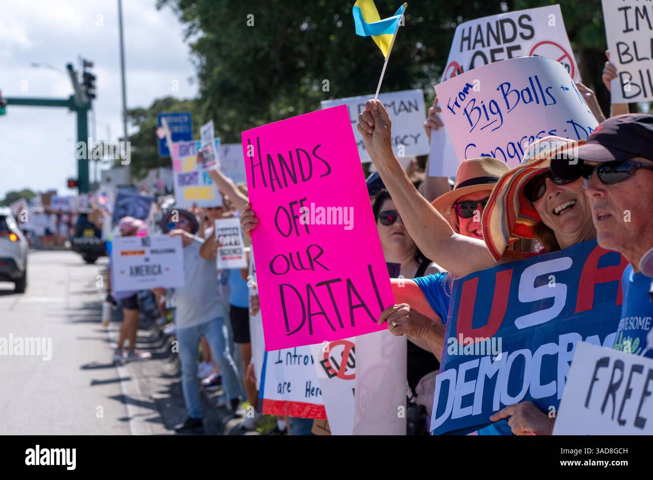 Activists protest President Donald Trump, who was a few miles away at ...