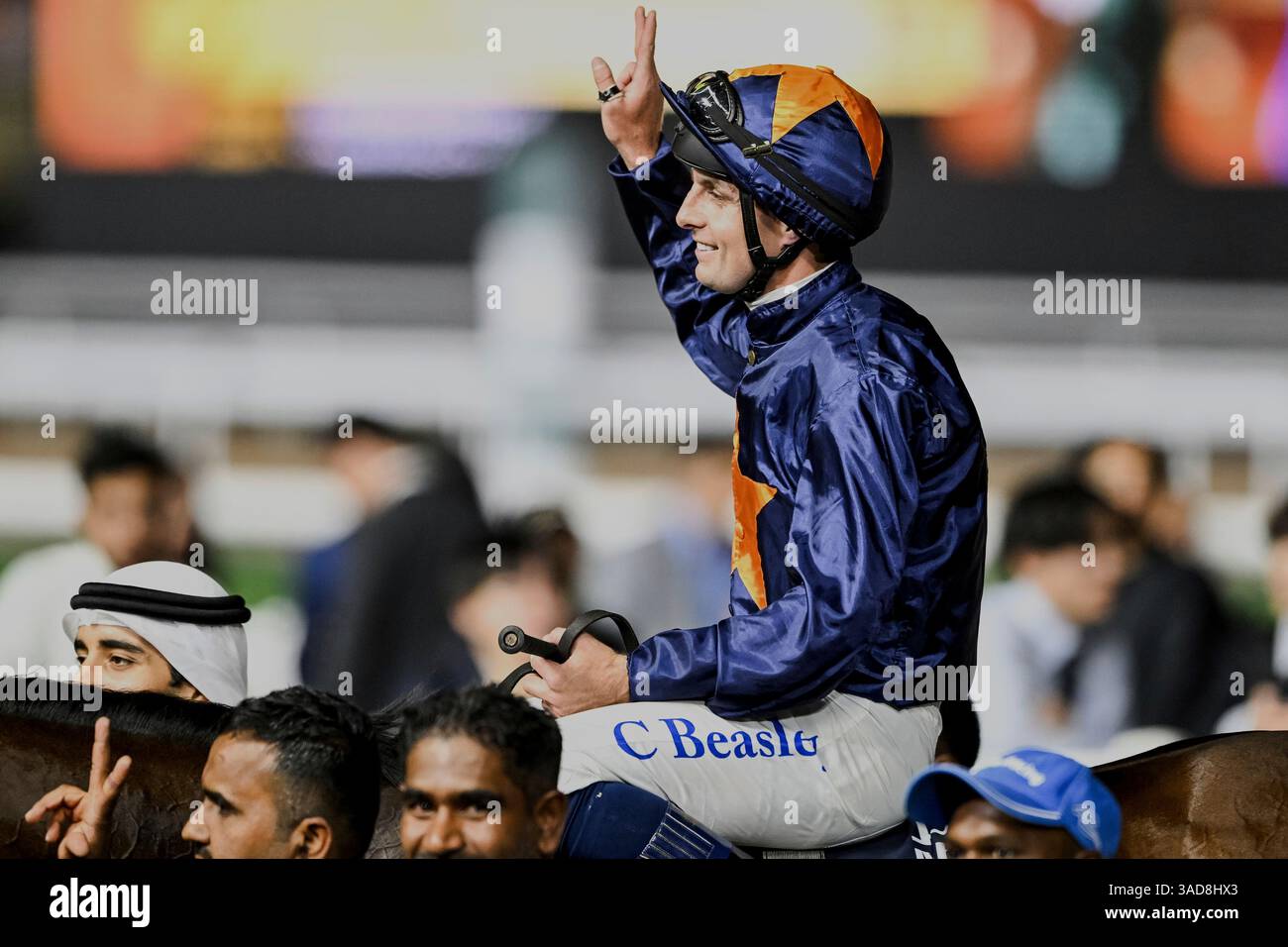 Dark Saffron's jockey Connor Beasley reacts after winning $2 million ...