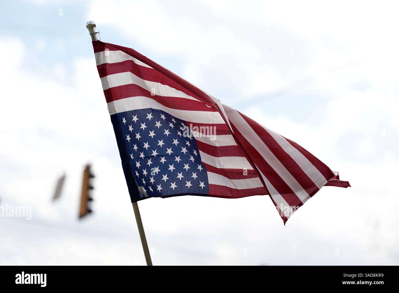 A U.S. flag flies during a civil rights demonstration, Saturday, April ...