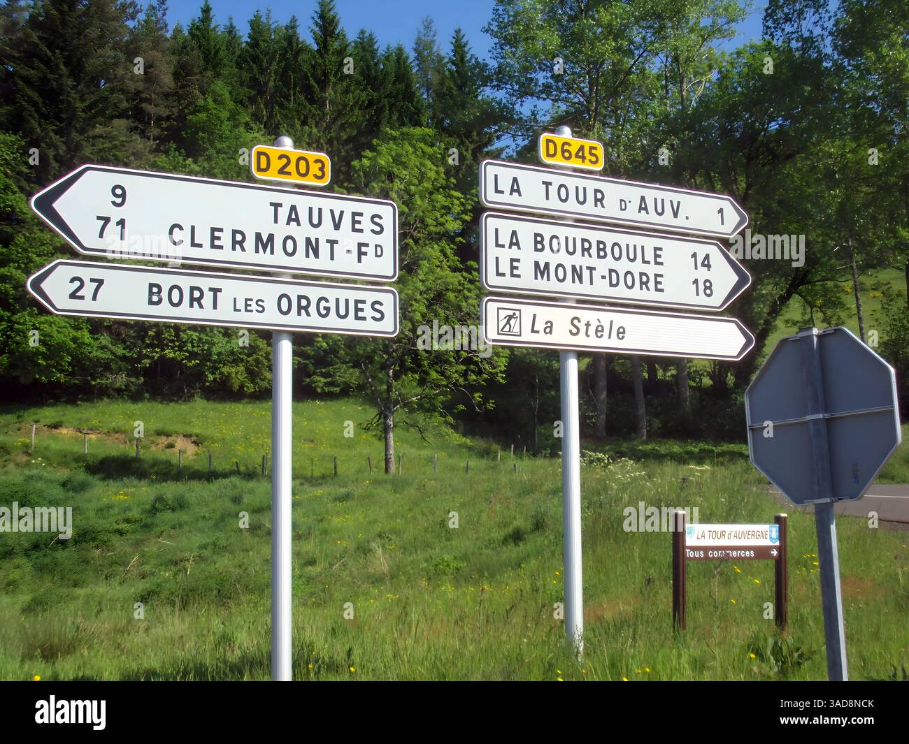 Road signs indicating directions to various locations in a rural area ...