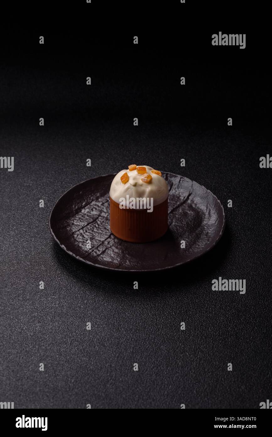 Easter sweet cake covered with icing with fruit and candied fruits ...