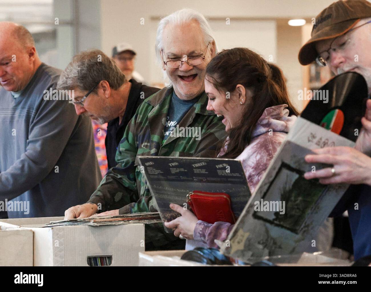 Michael Fulkerson, center, laughs with his granddaughter, Hannah ...
