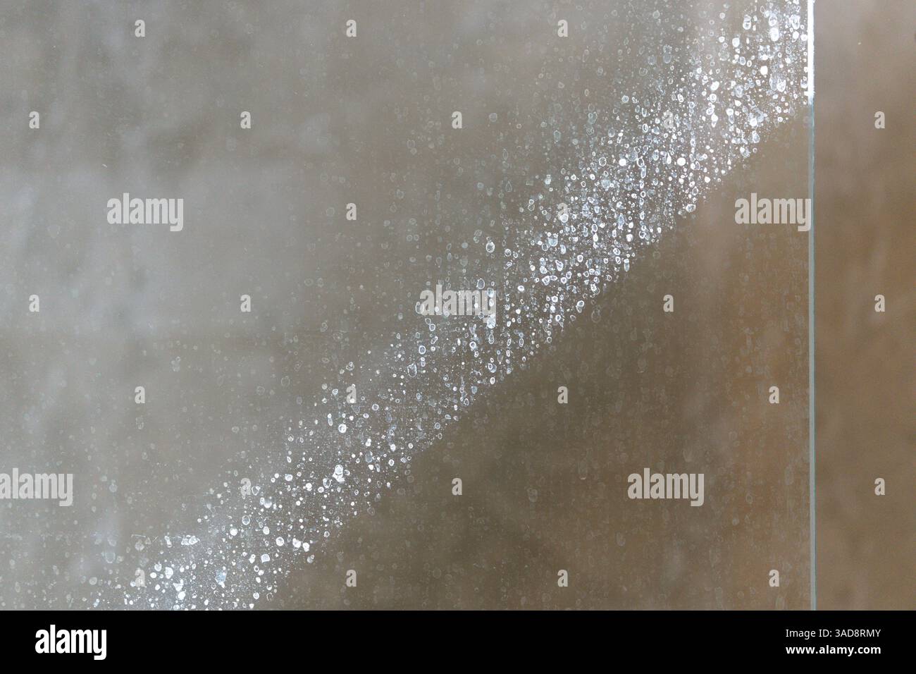Hard water stains on the glass in the shower Stock Photo - Alamy