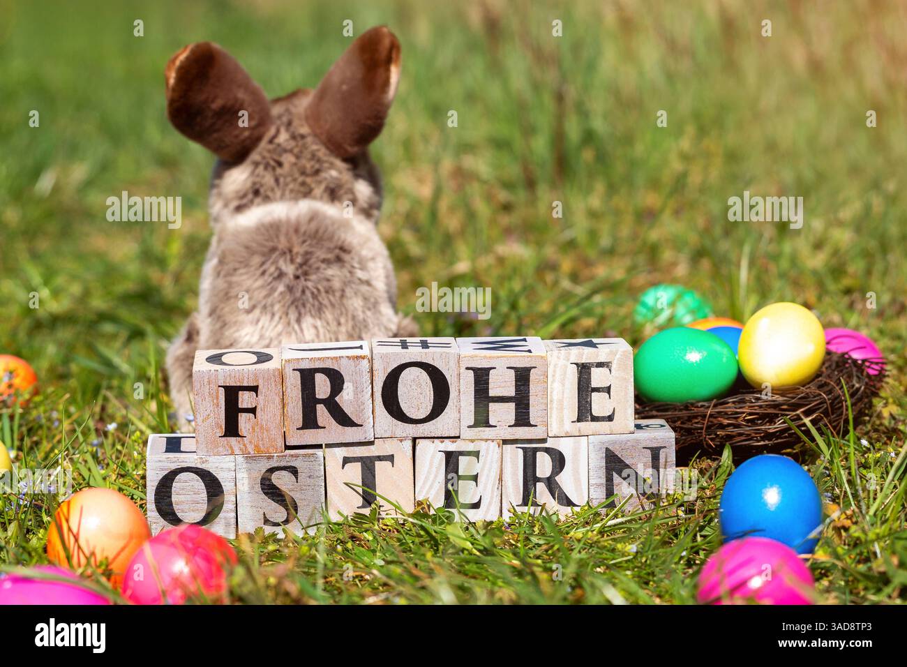 Bavaria, Germany - 5 April 2025: Colorful Easter eggs and wooden blocks ...