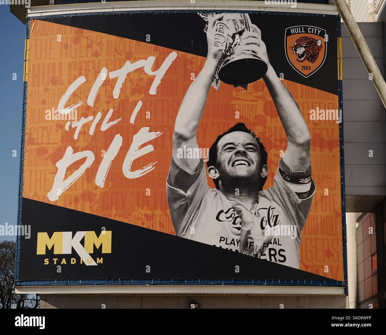A large poster on the outside of the stadium beforethe Betfred ...