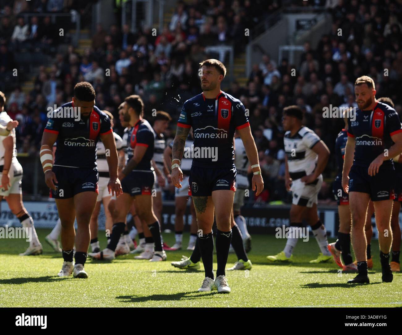 Hull K.R. players walk back to their line during the Betfred Challenger ...