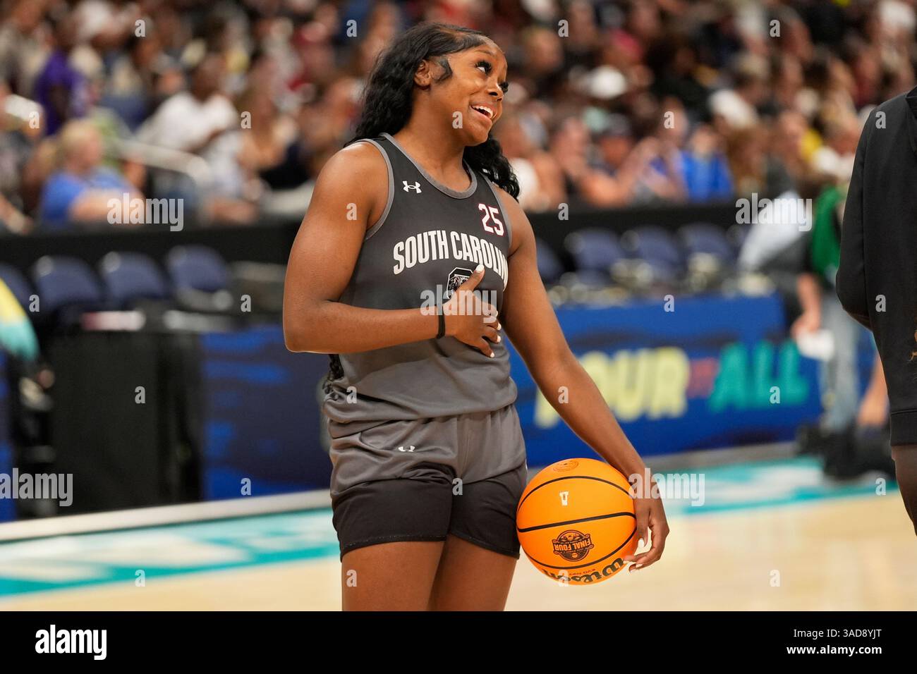 South Carolina guard Raven Johnson (25) laughs with teammates during ...
