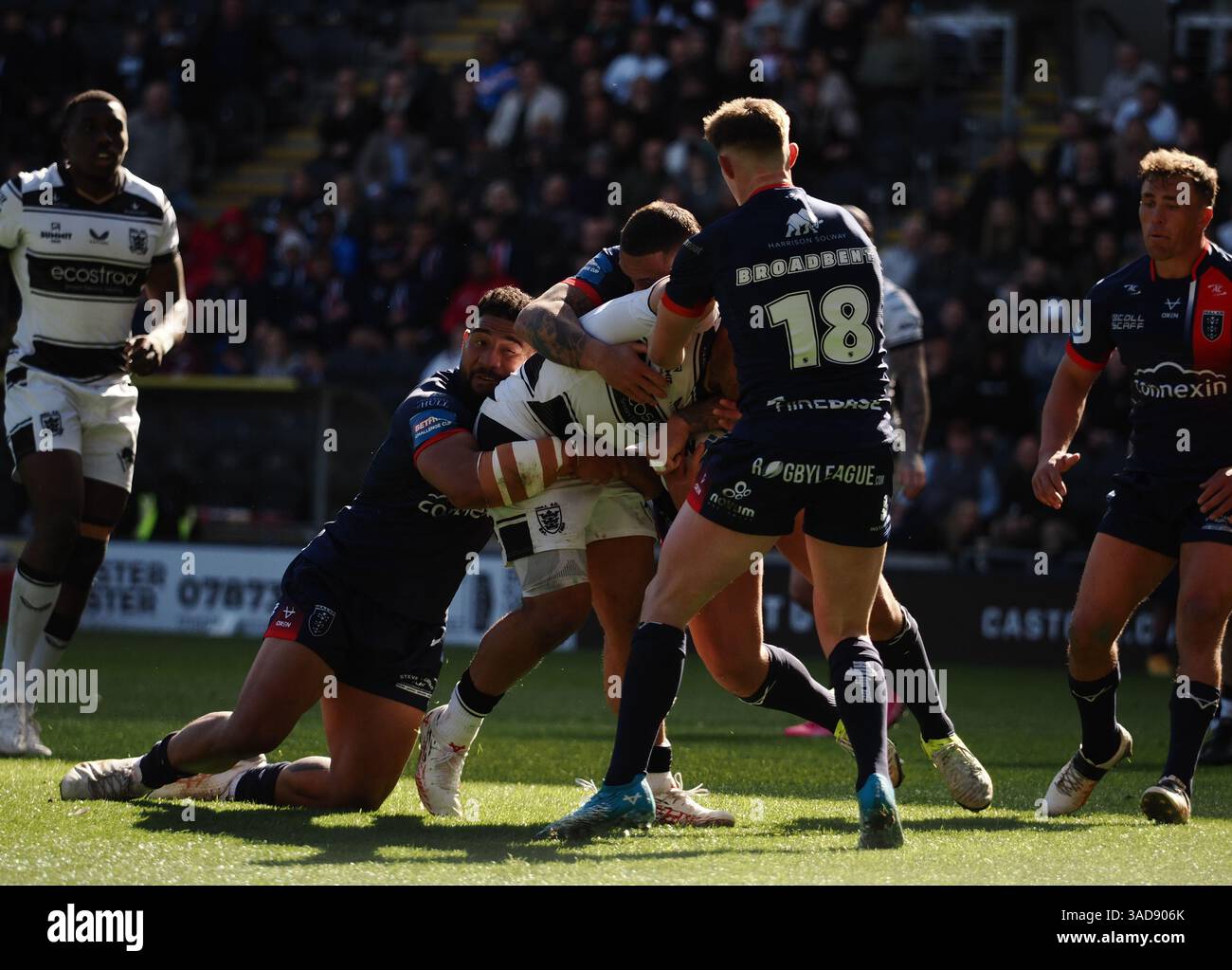 Jack Broadbent of Hull KR tries to hold the defence during the Betfred ...