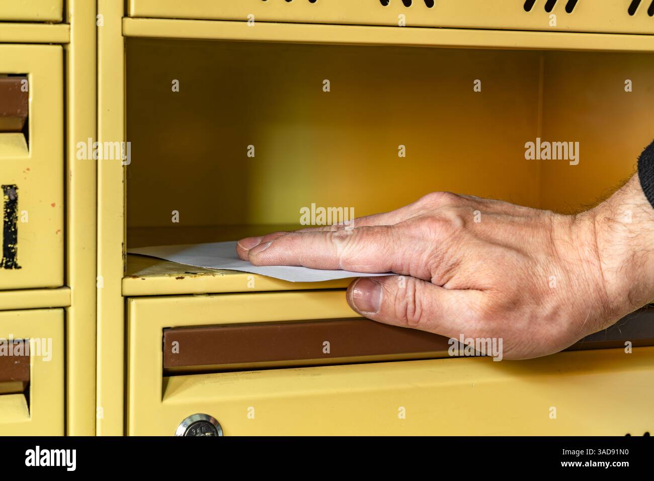 Yellow mailboxes in the stairwell of a block of flats, distribution of ...