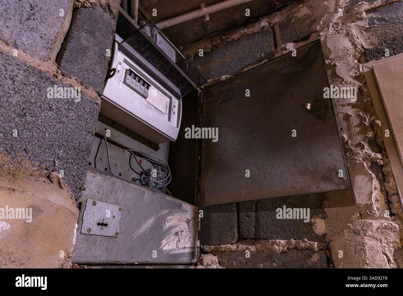 Old electrical fuse box on the wall in the basement, removing power ...
