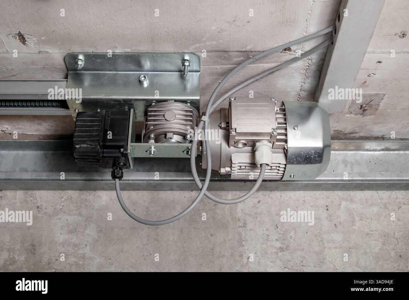 Parking gate engine or motor in parkade or garage of building. Close of ...