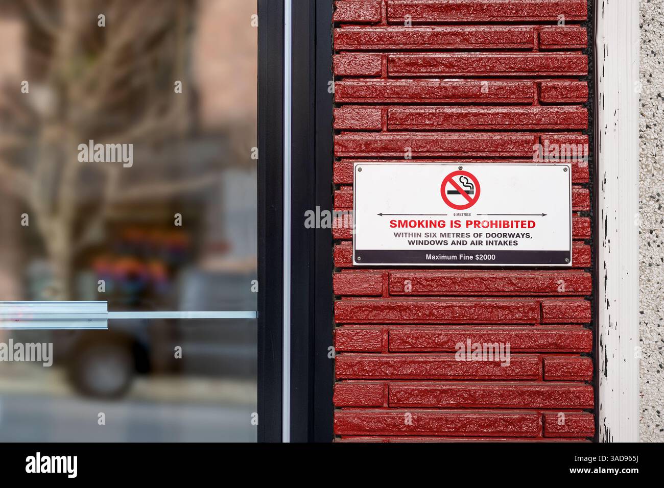 No smoking sign or poster by building entrance. Smoking is prohibited ...