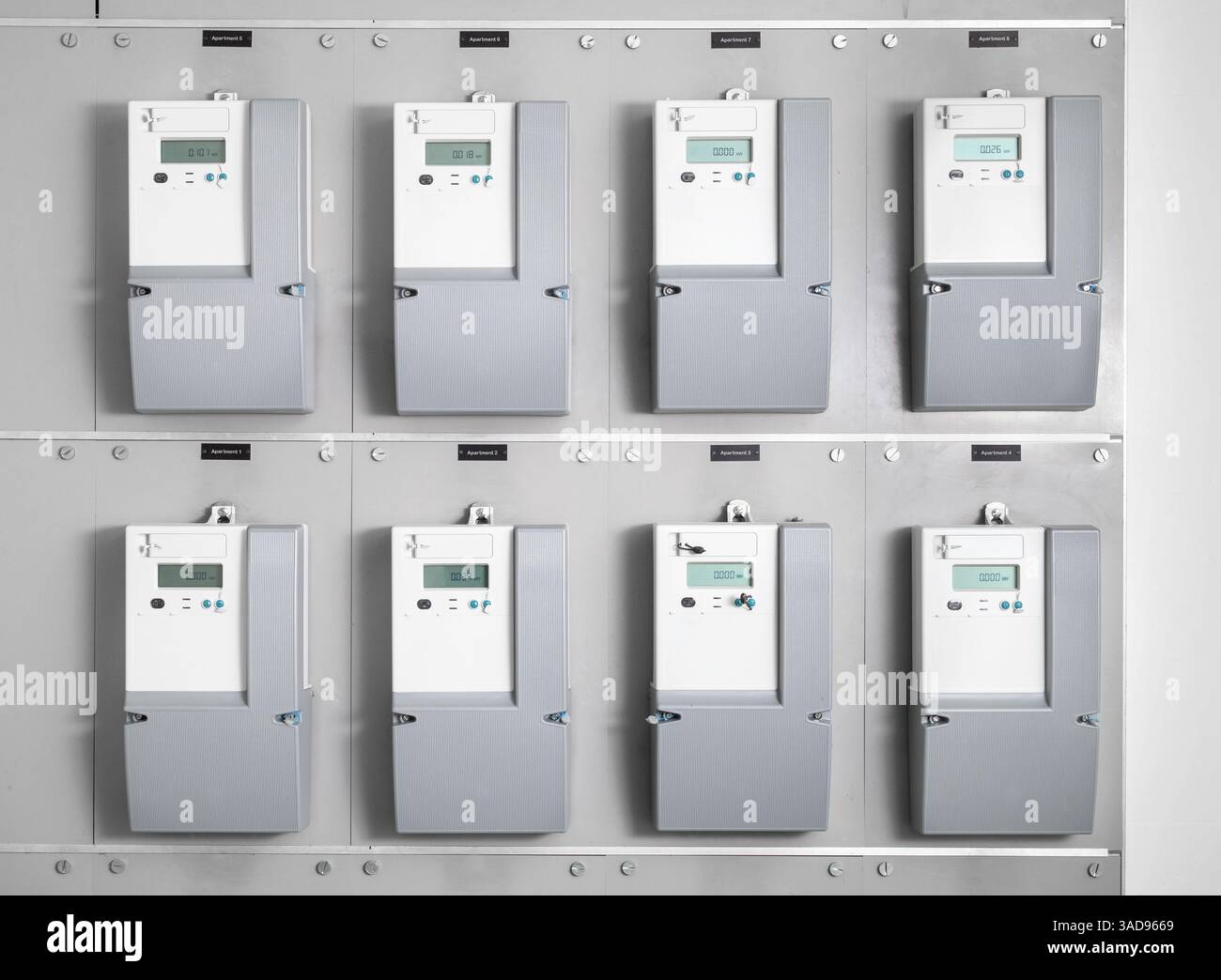 Many smart meters in electrical room of building. Digital meter ...