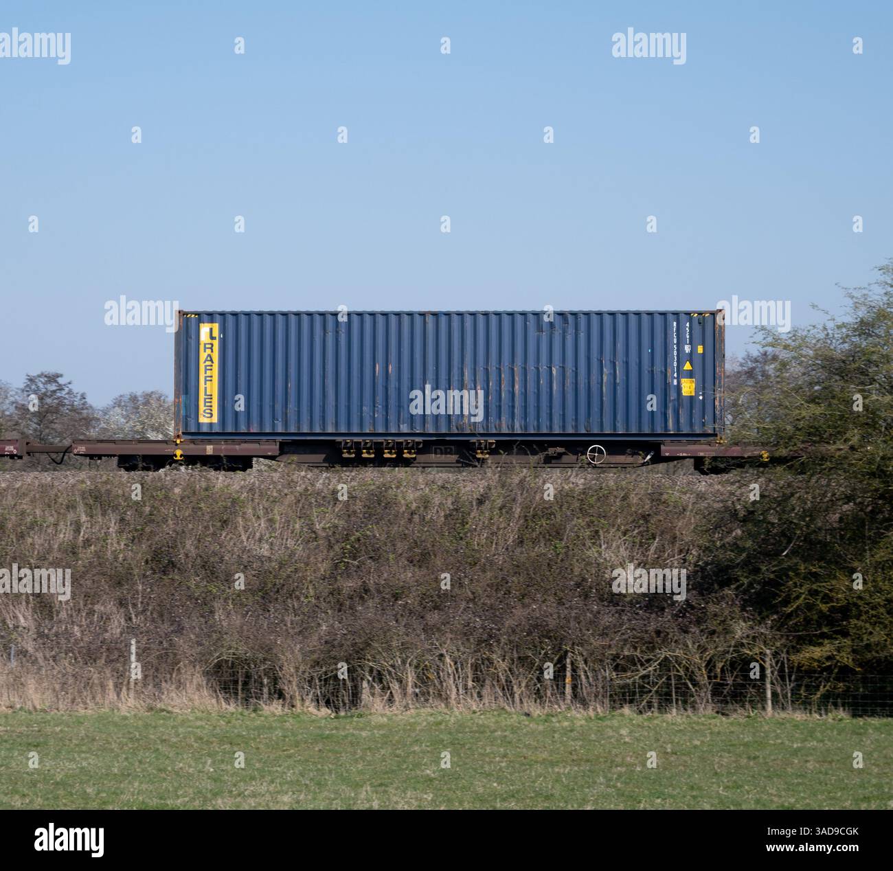 Raffles shipping container on a freightliner train, Warwickshire, UK ...