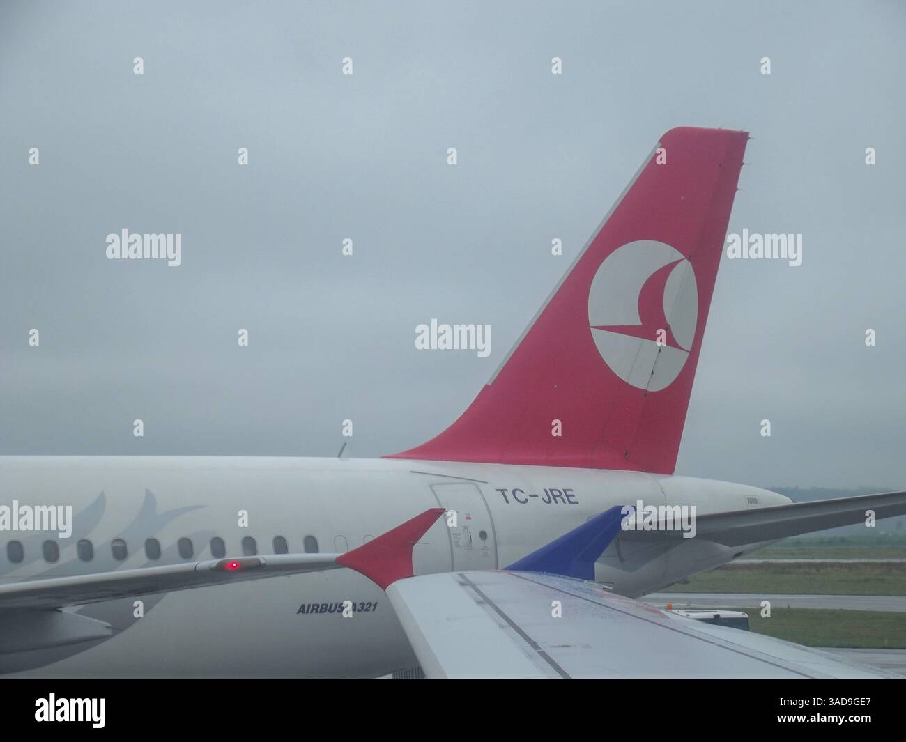 A close-up view of an airplane tail featuring the logo of a Turkish ...