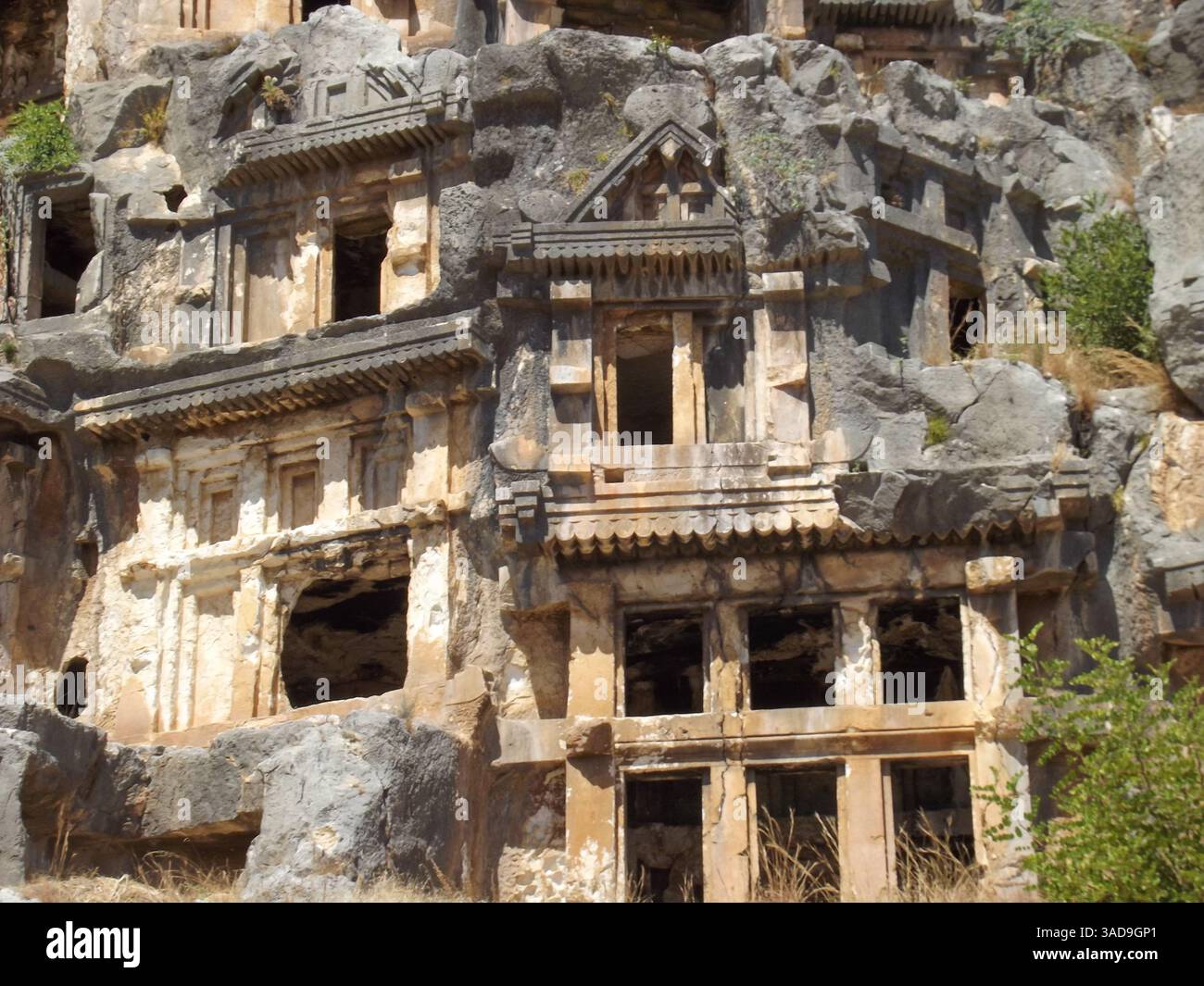 Ancient rock-cut tombs with intricate carvings and architectural ...