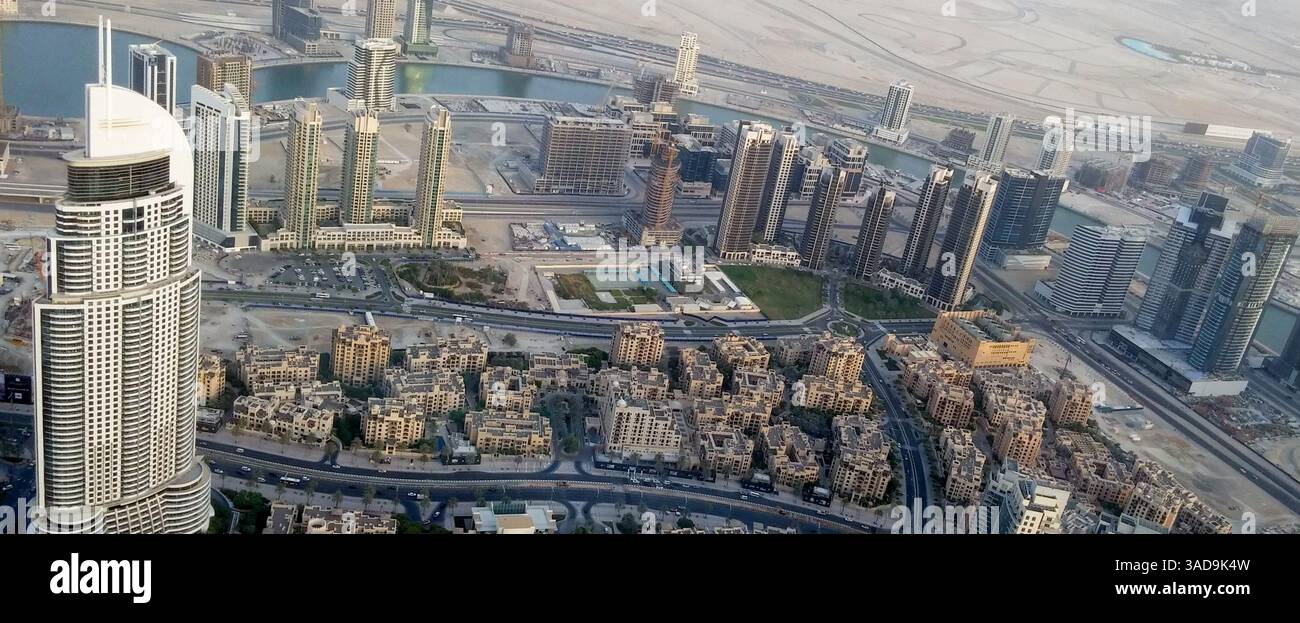 Aerial view of a modern cityscape featuring tall skyscrapers, a mix of ...