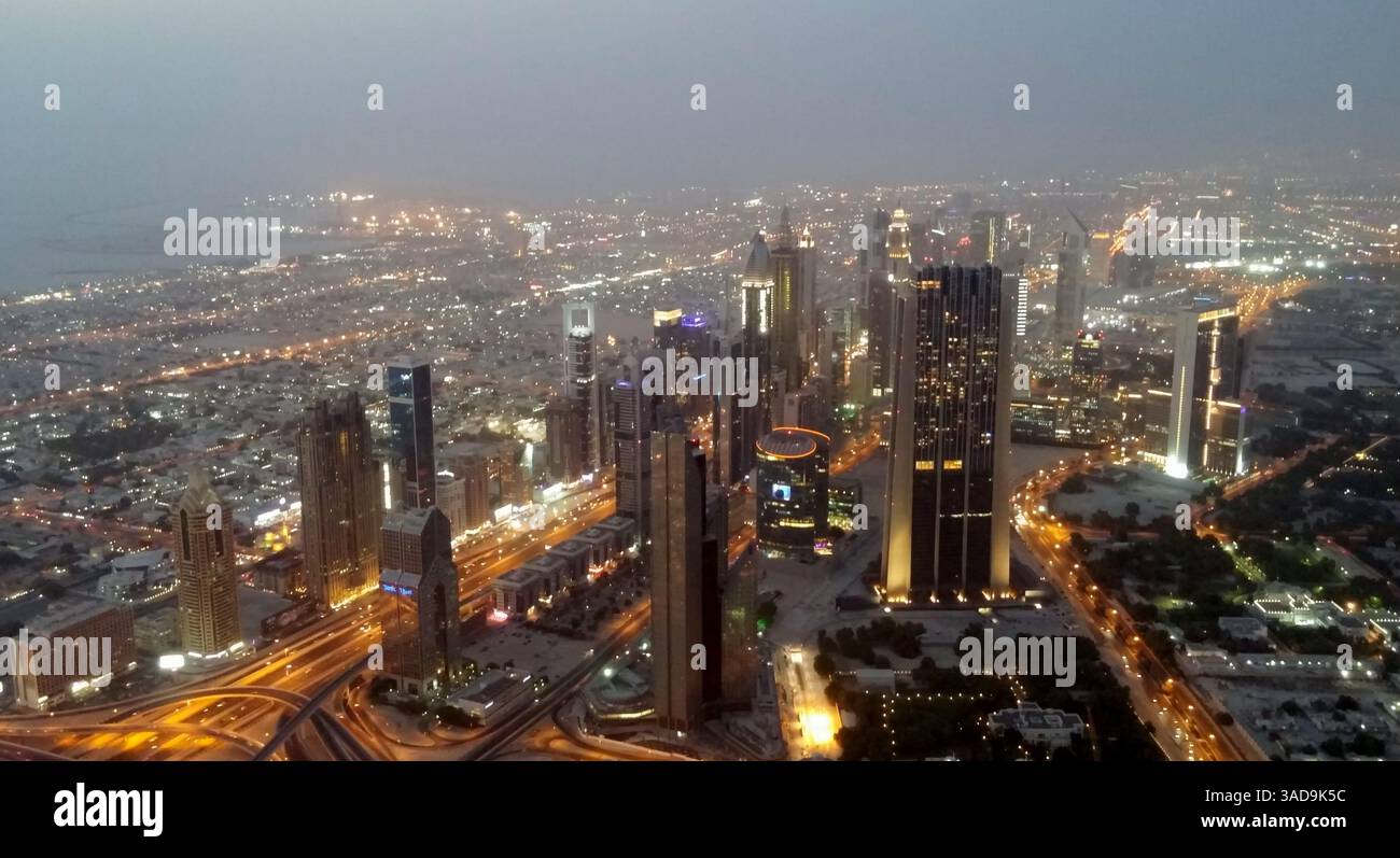 Aerial view of a bustling city skyline at dusk, showcasing tall ...