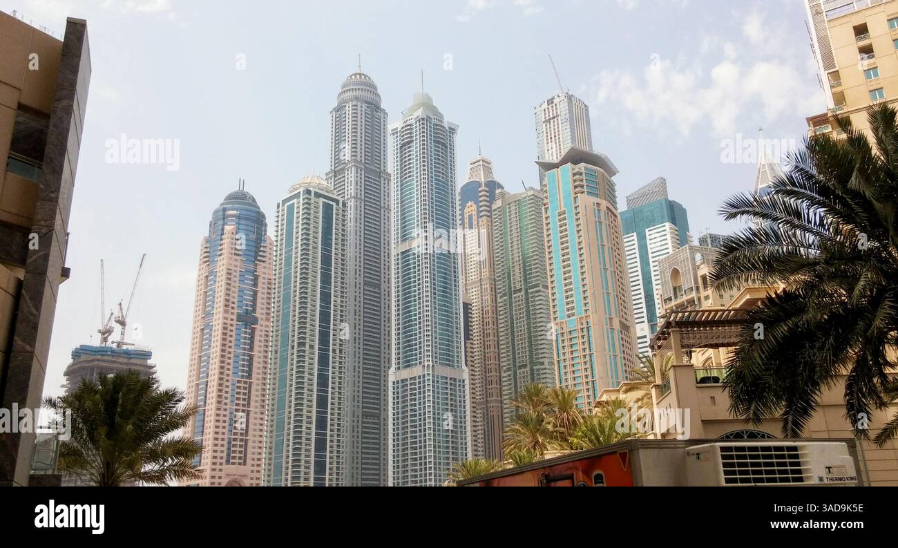 A view of modern skyscrapers in Dubai, showcasing a mix of ...