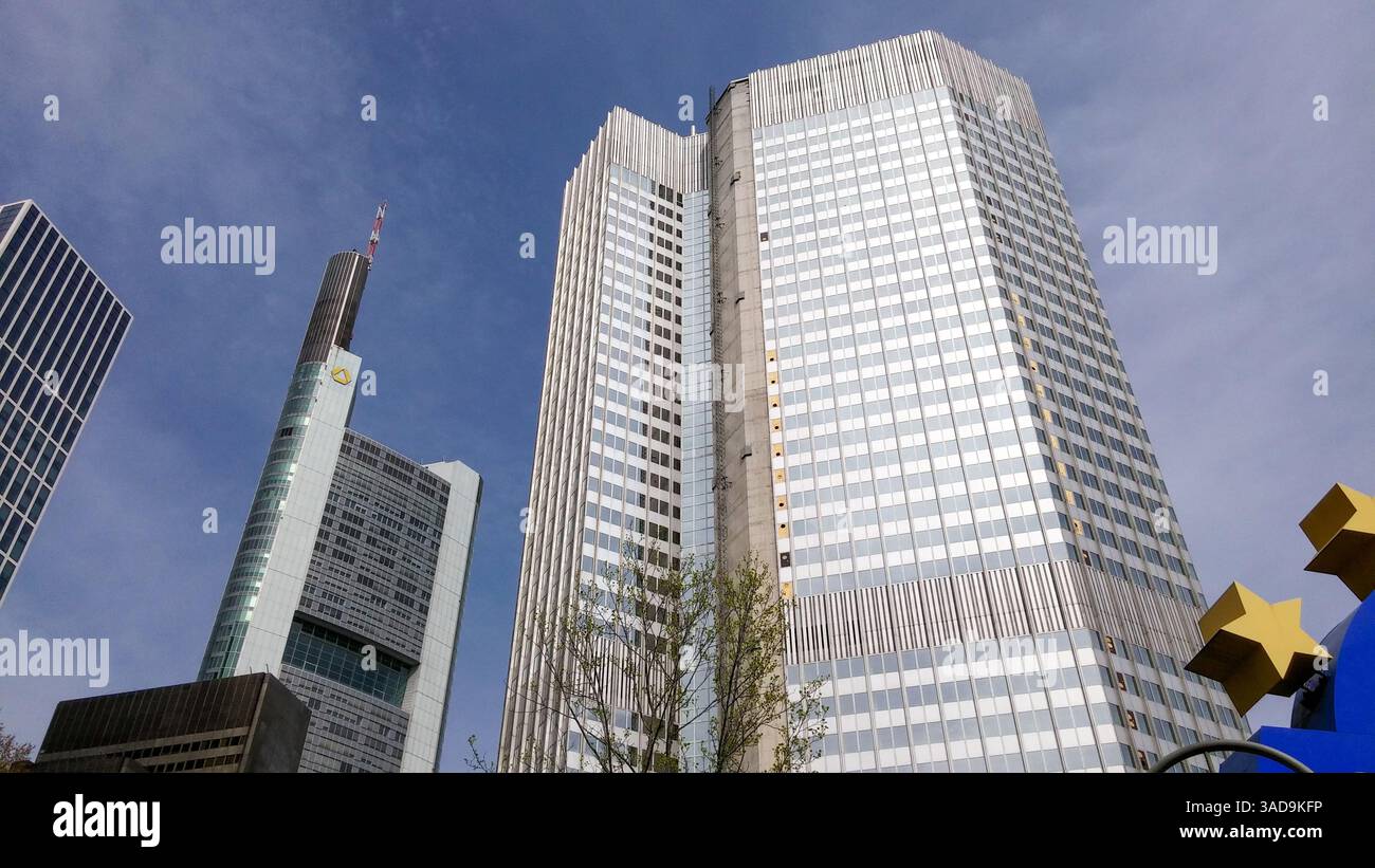 A view of modern skyscrapers against a blue sky, showcasing glass and ...