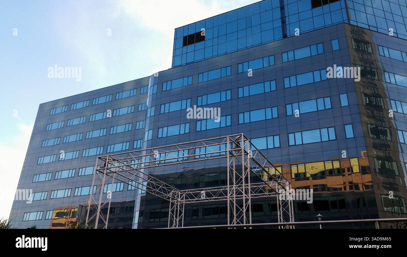 Building features large glass windows reflecting hi-res stock ...