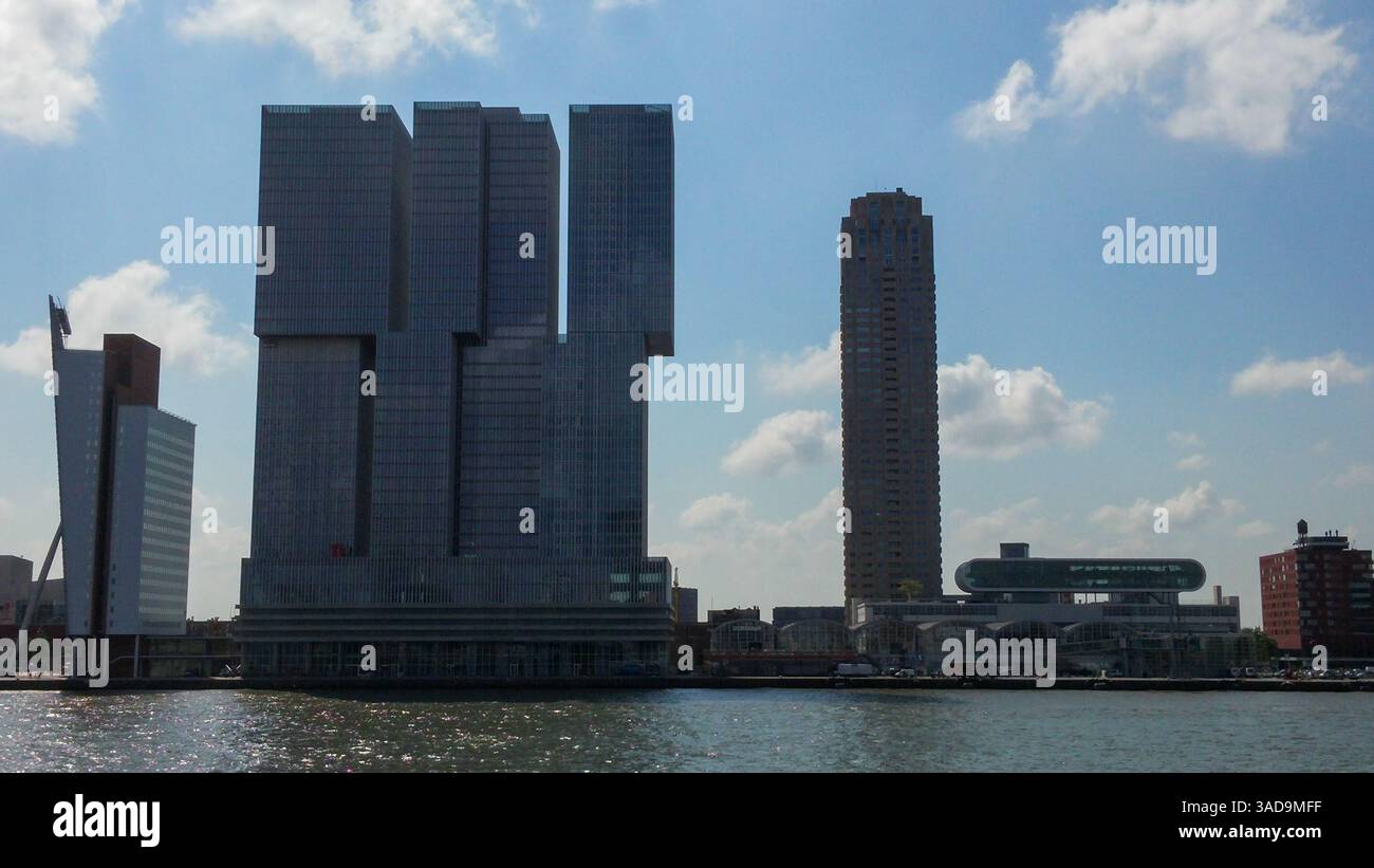 A skyline view featuring modern skyscrapers along a river. The ...