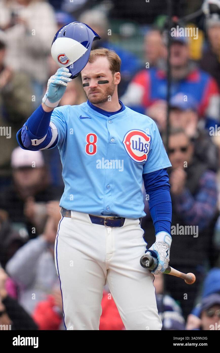 Playing in his 1000th game, Chicago Cubs' Ian Happ (8) acknowledges ...