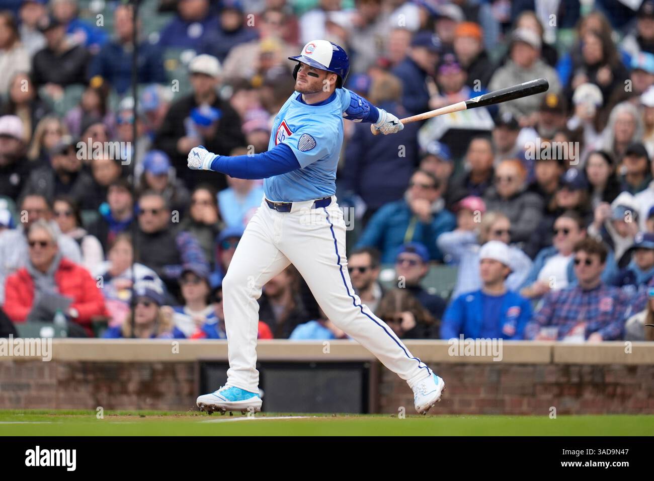 Chicago Cubs' Ian Happ (8) hits a double during the first inning of a ...