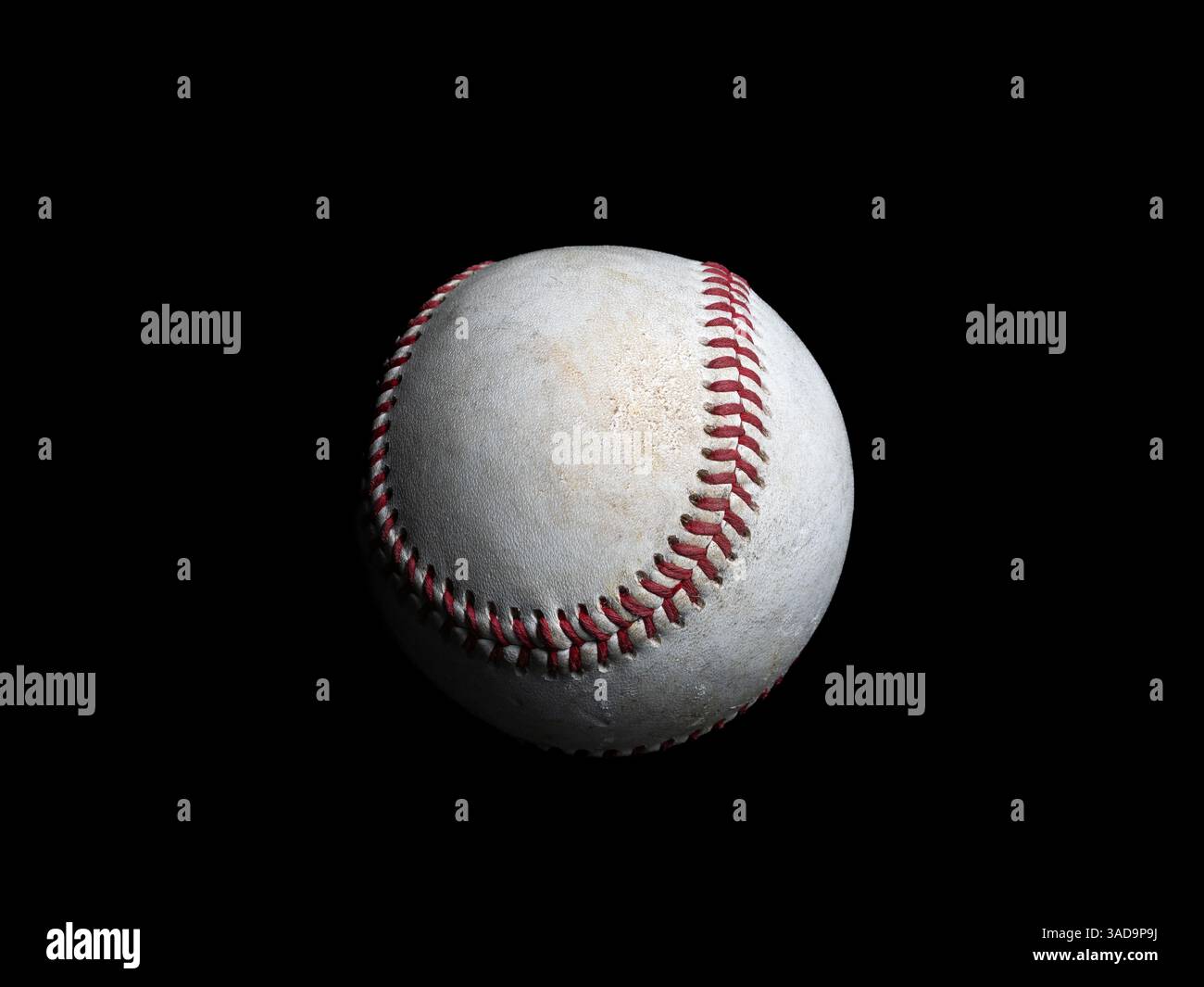 A single baseball viewed from the side, isolated on a deep black ...