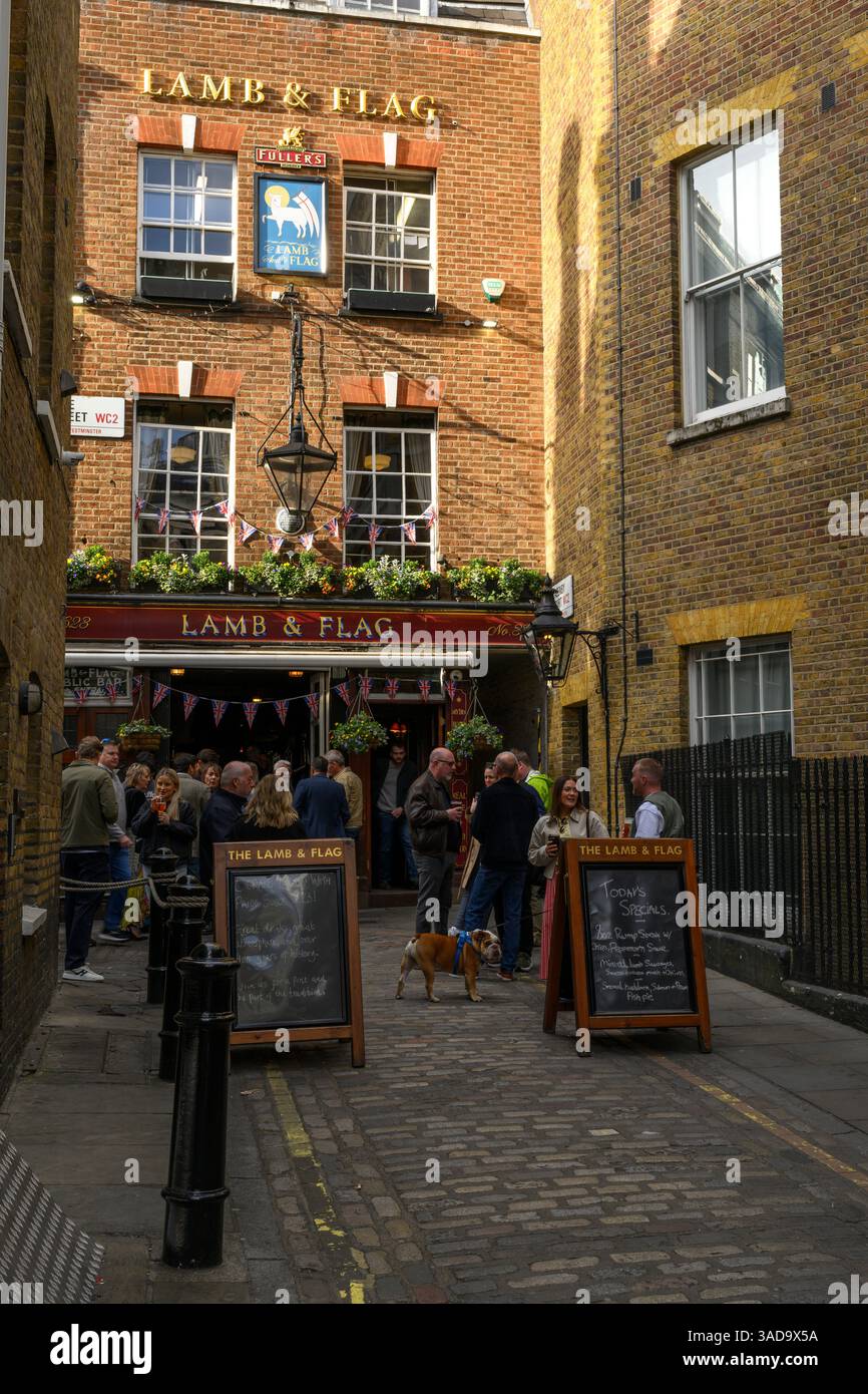 People drinking outside the The Lamb & Flag pub, Rose Street, Covent ...