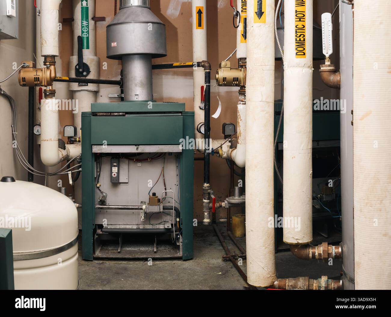 Hot water heating system in boiler room of residential building ...