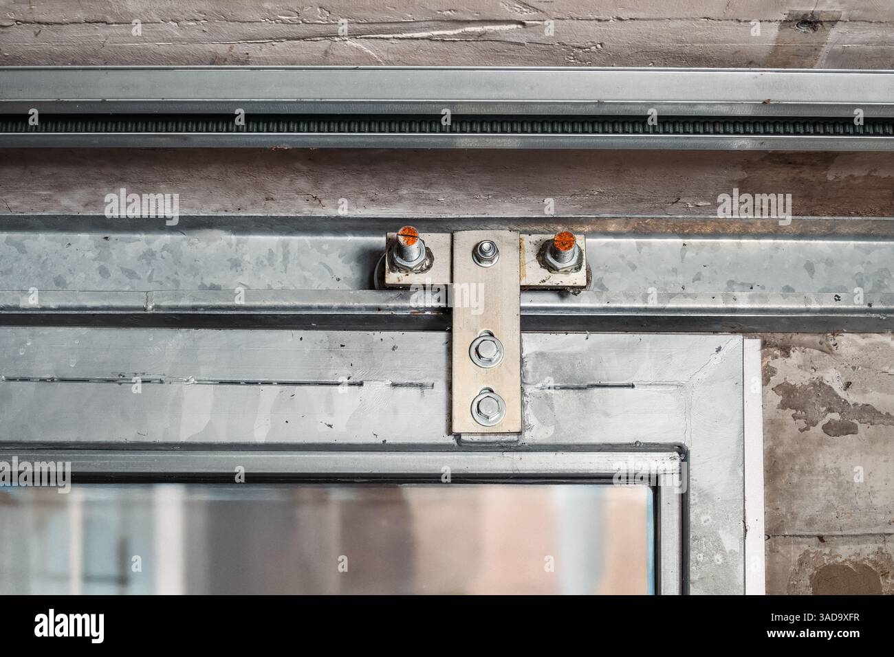 Parking gate sliding mechanism in garage of building. Close up of ...