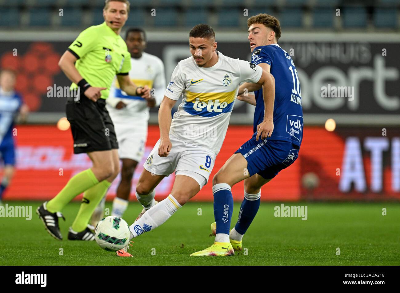 Franjo Ivanovic (9) of Union fighting for the ball with Mathias Delorge ...