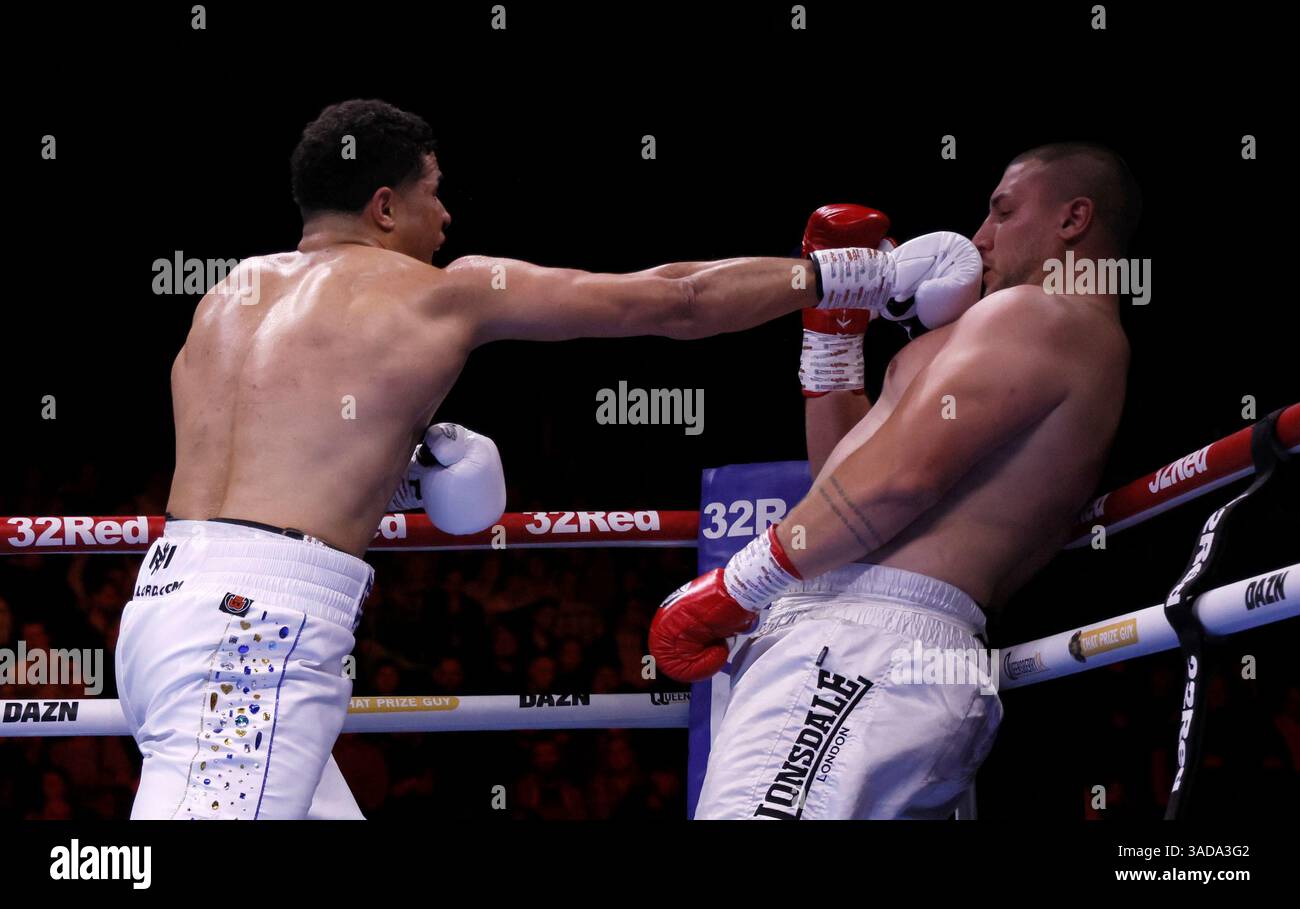 Delicious Orie (left) in action against Milos Veletic (right) at the Co ...