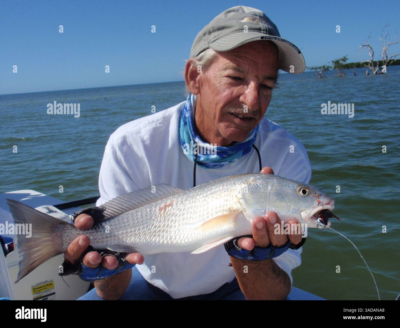 Jan. 15, 2012 - Chokoloskee, FL, USA - Captain Bert Barkus holds up a ...