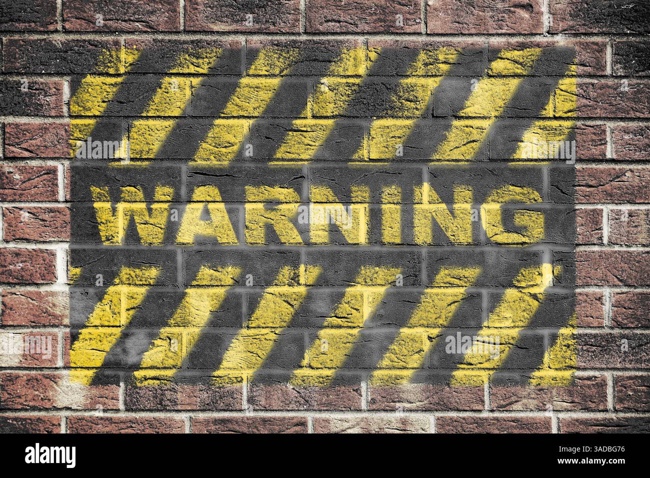 Warning danger sign on brick wall background Stock Photo - Alamy