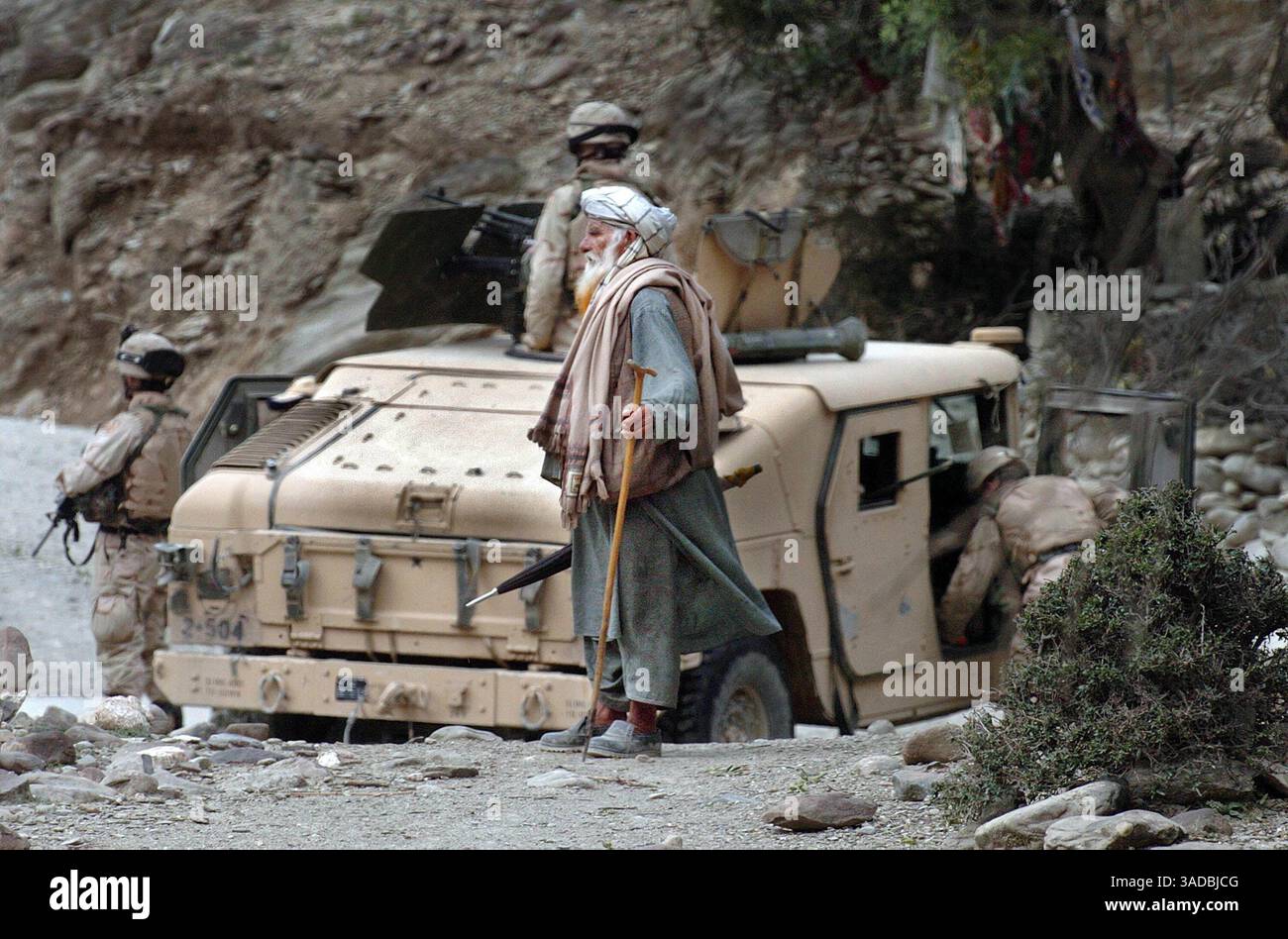 May 25, 2005; Yaqubi, AFGHANISTAN; An elderly Afghan man watches as ...