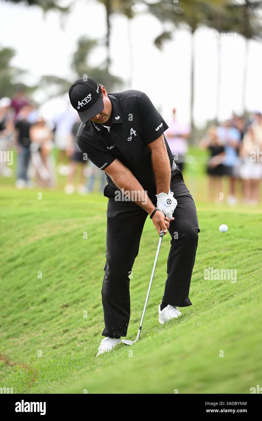 Patrick Reed of the 4Aces GC chips from the bottom of a hill during Day ...