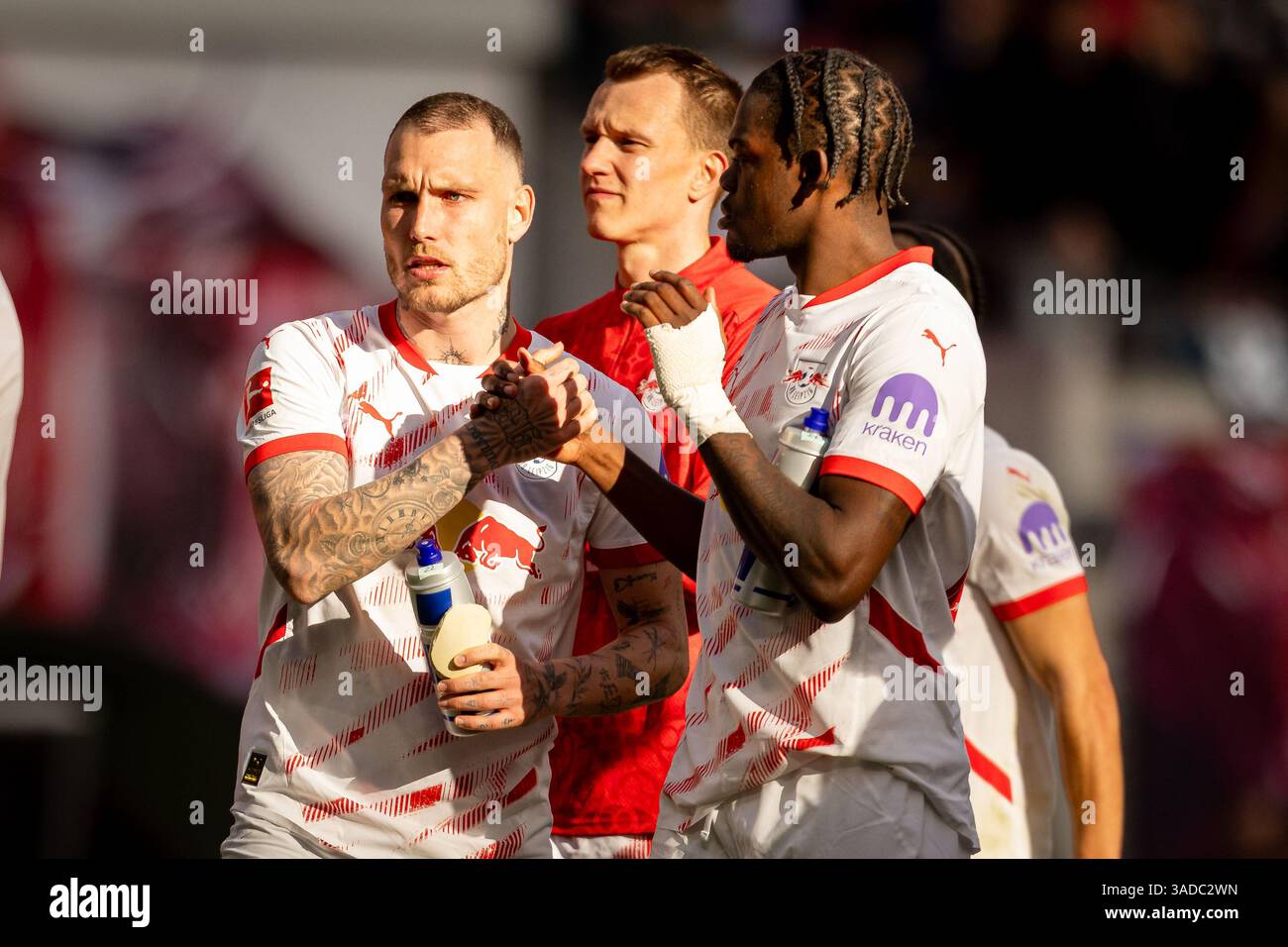 Leipzig, Germany. 05th Apr, 2025. David Raum (L) and Castello Lukeba (R ...