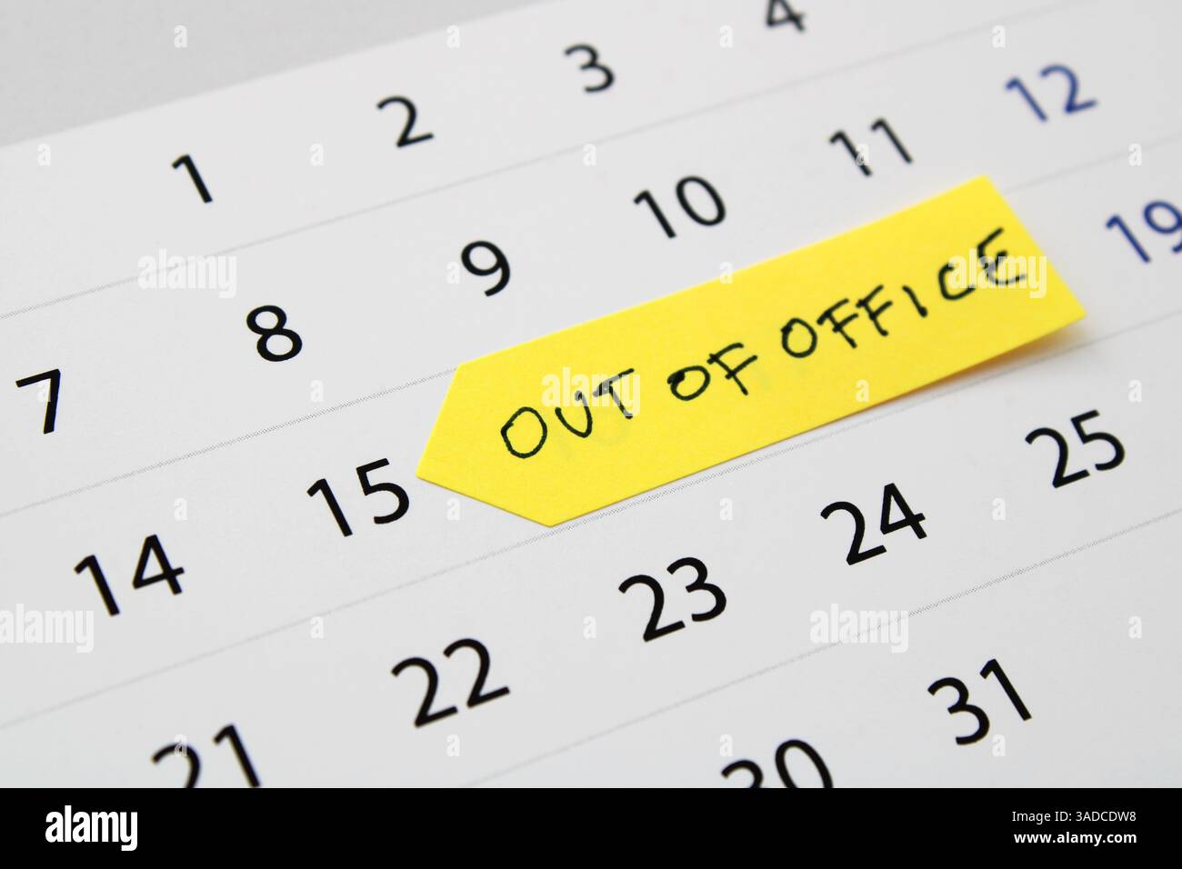Out of the office, sticky note marking day on the calendar Stock Photo ...