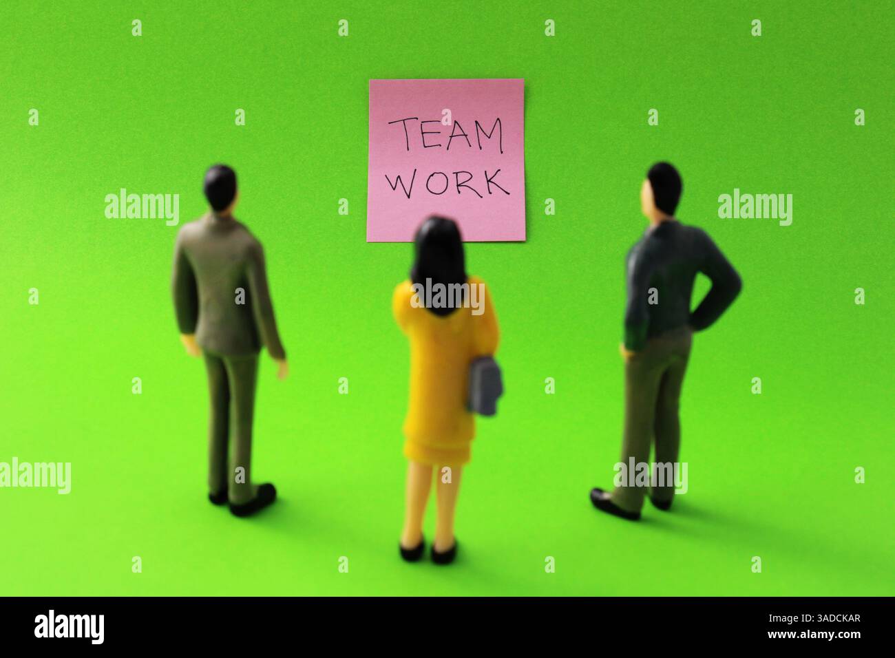 Work team in front of a sticky note Stock Photo - Alamy