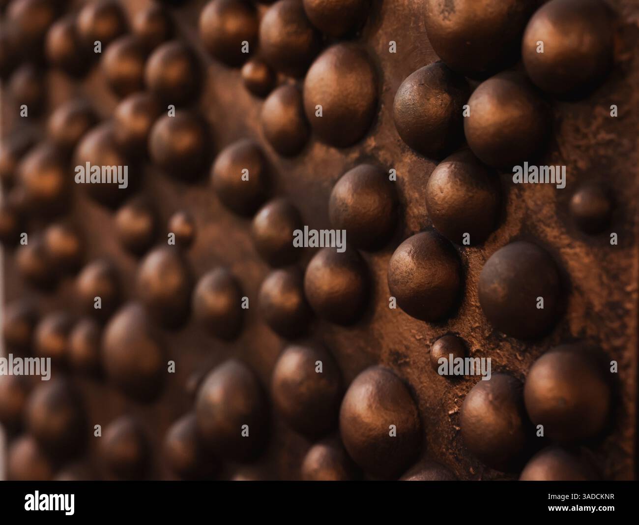 A CloseUp of a Detailed Textured Metal Surface Featuring Raised Bumps ...