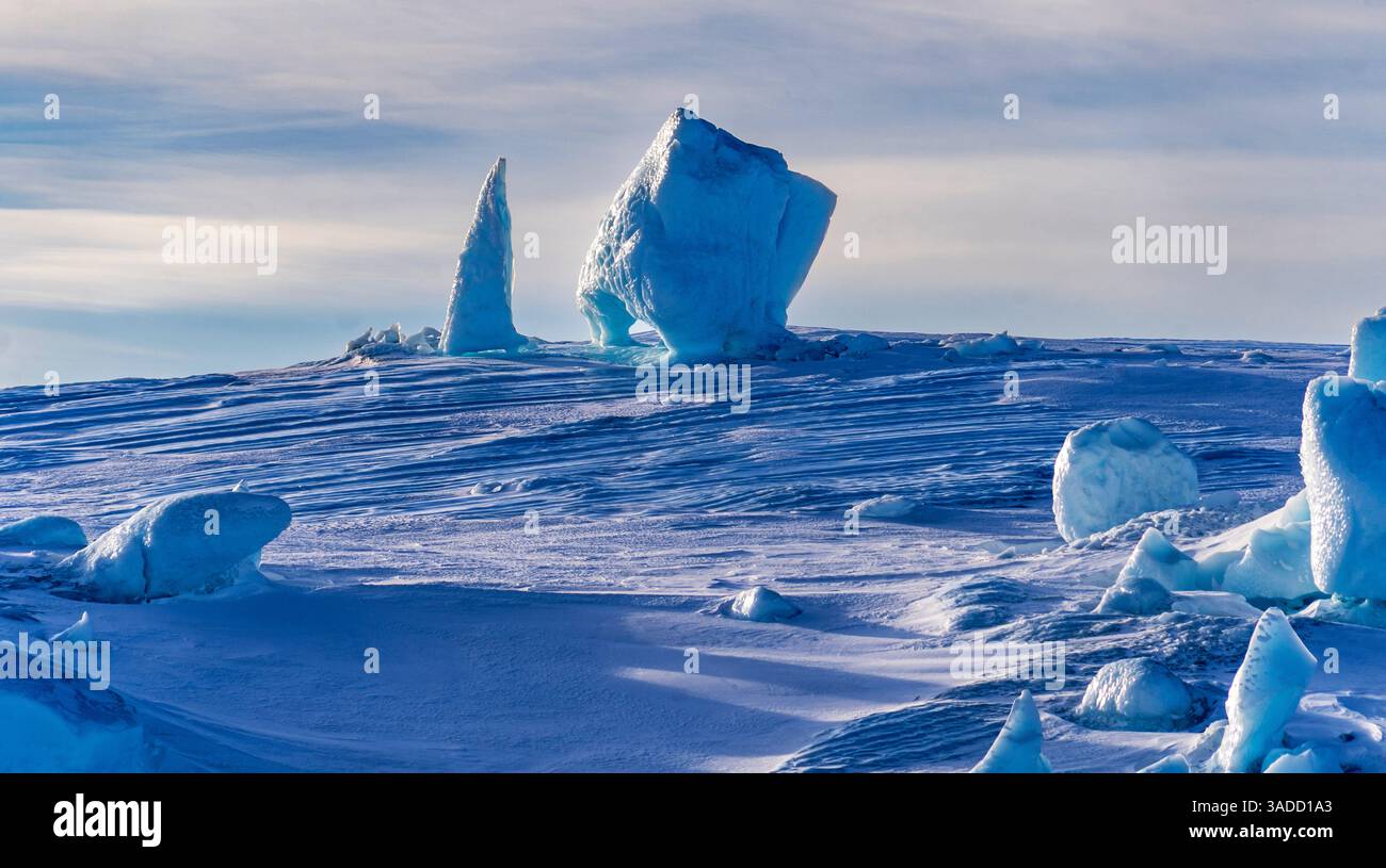 A stunning icy landscape featuring large ice formations and snow ...