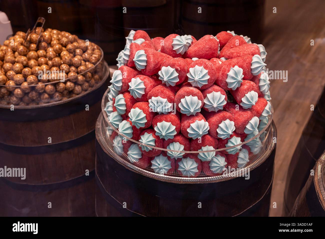 Close-up shot shows two glass dishes filled with candies, displayed on ...