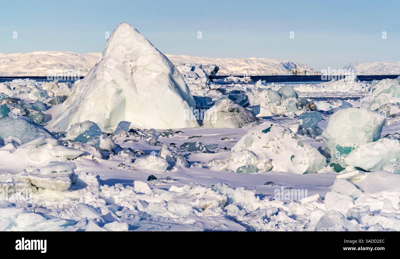 A stunning winter landscape featuring large ice formations and snow ...
