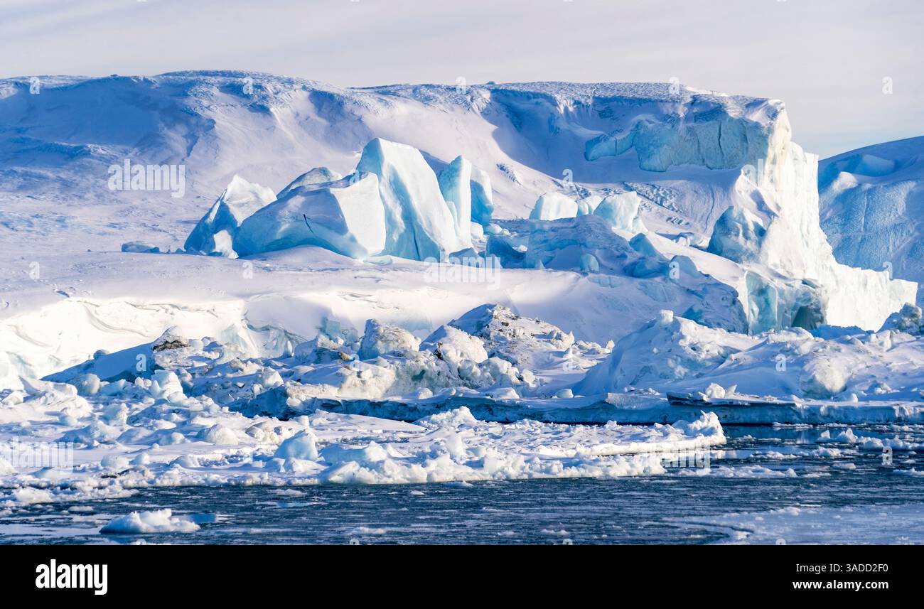 A stunning view of icy landscapes featuring large icebergs and glacial ...