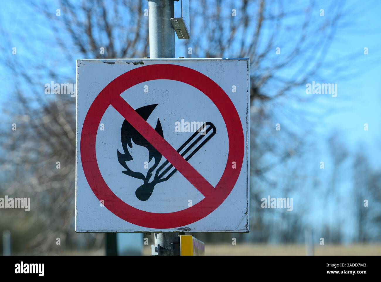A red and white no smoking sign displays a matchstick with flames ...